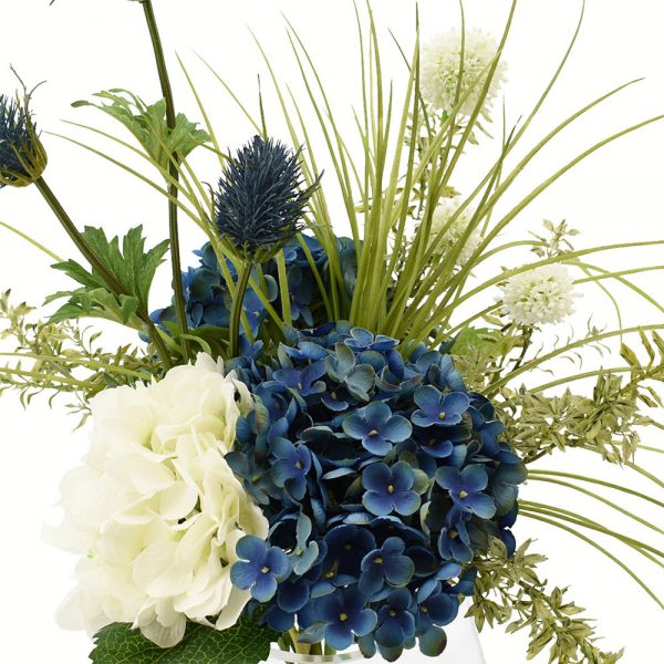 Hydrangea, Blue Thistle, Allium and Tea Leaves in a Glass Vase ...