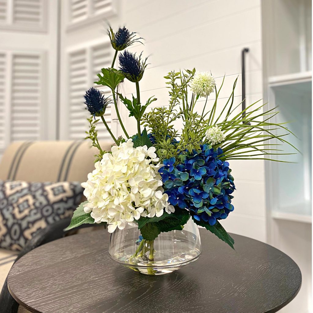 Hydrangea, Blue Thistle, Allium and Tea Leaves in a Glass Vase ...